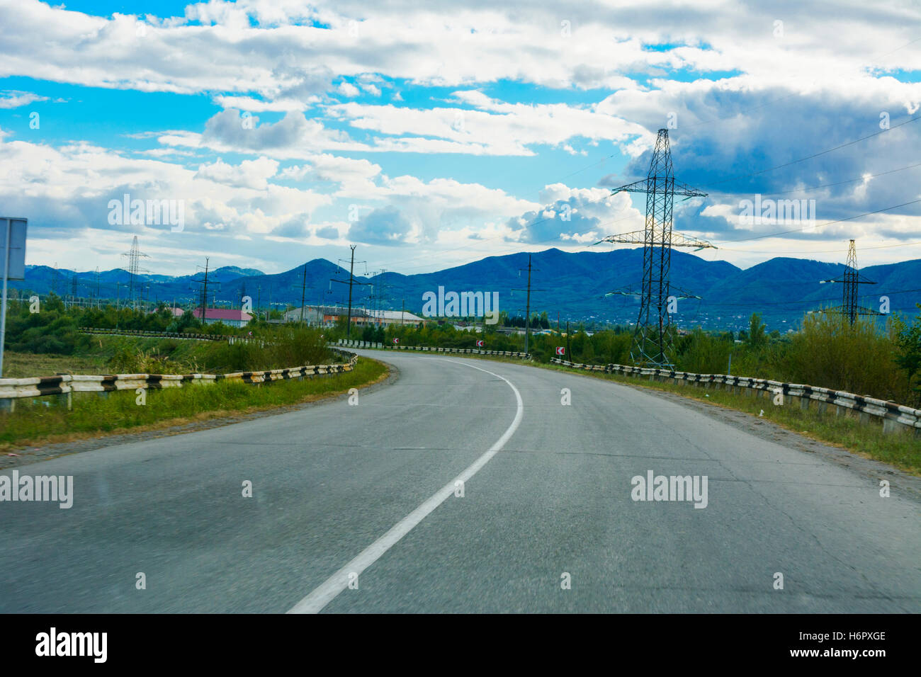 Mountain road. The landscape of fields and mountains Stock Photo - Alamy