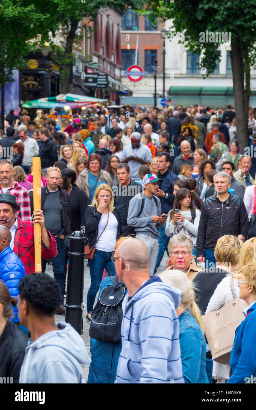 The very busy place of Covent Garden in London - huge crowd of tourists ...
