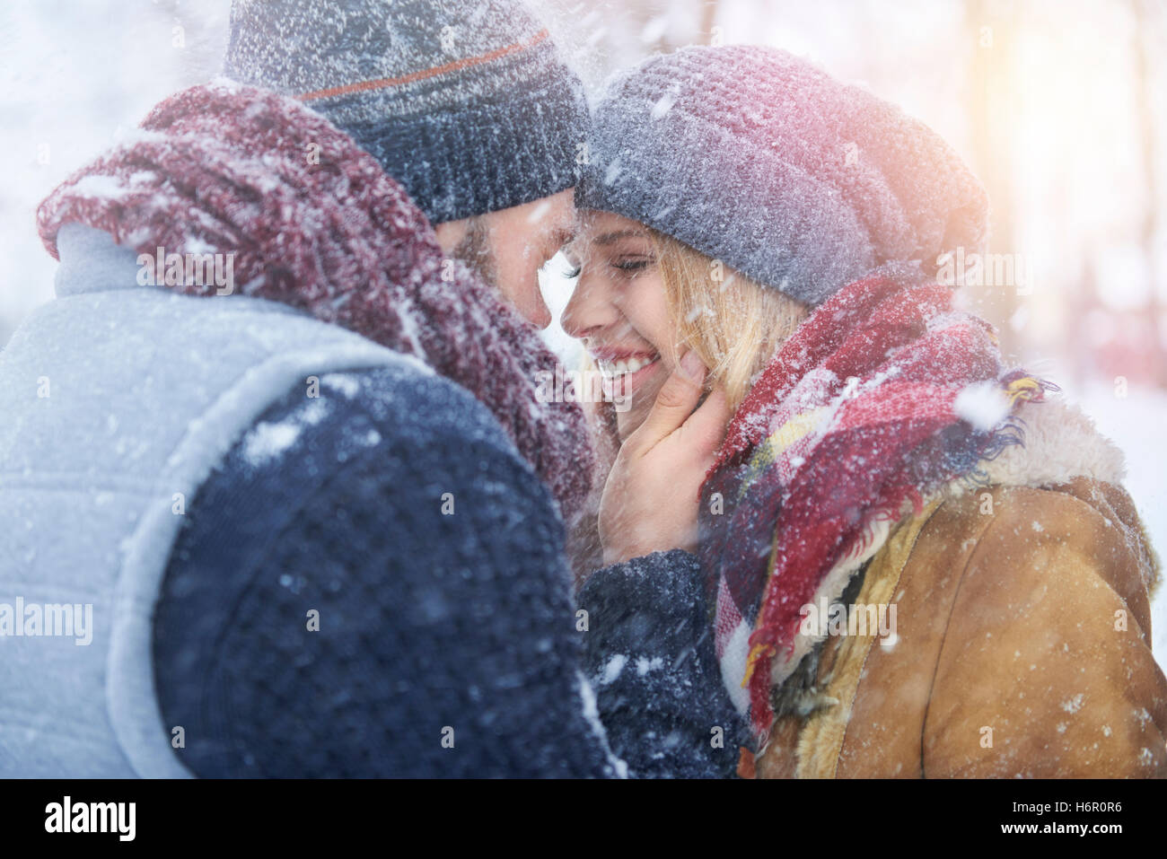 Couple in love in winter scenery Stock Photo - Alamy