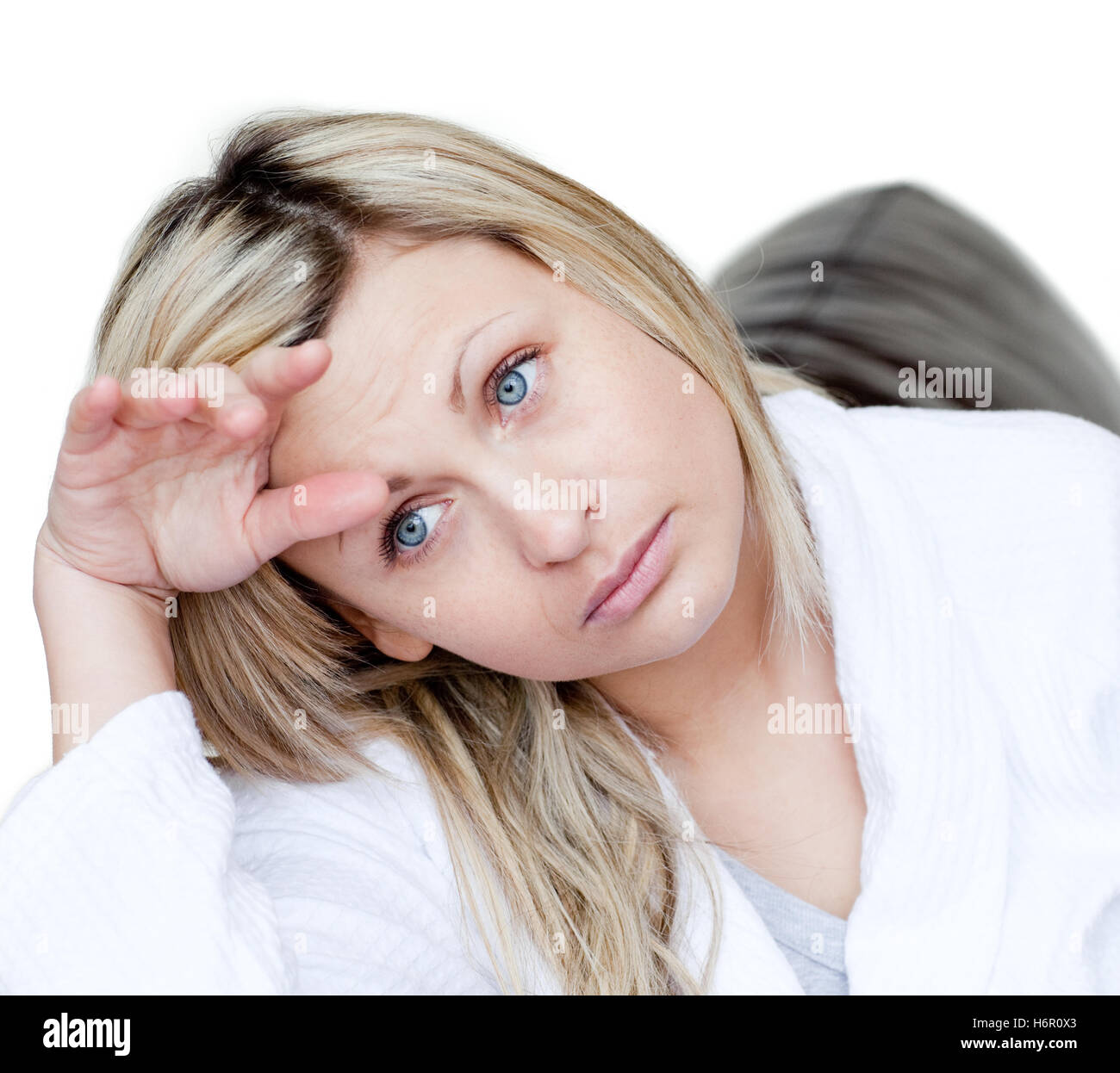 Tired woman thinking against a white background Stock Photo - Alamy