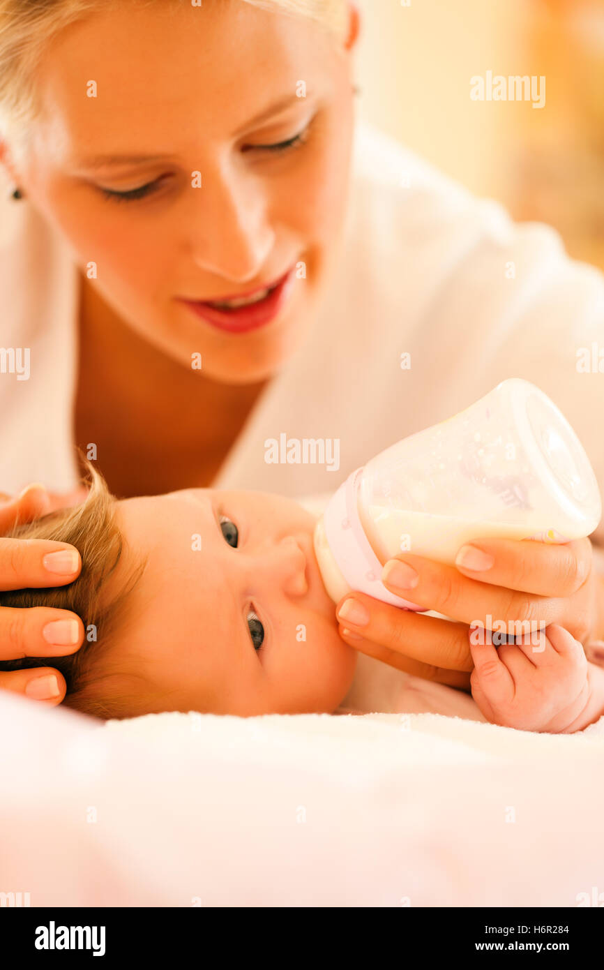 mother feeding her baby Stock Photo - Alamy