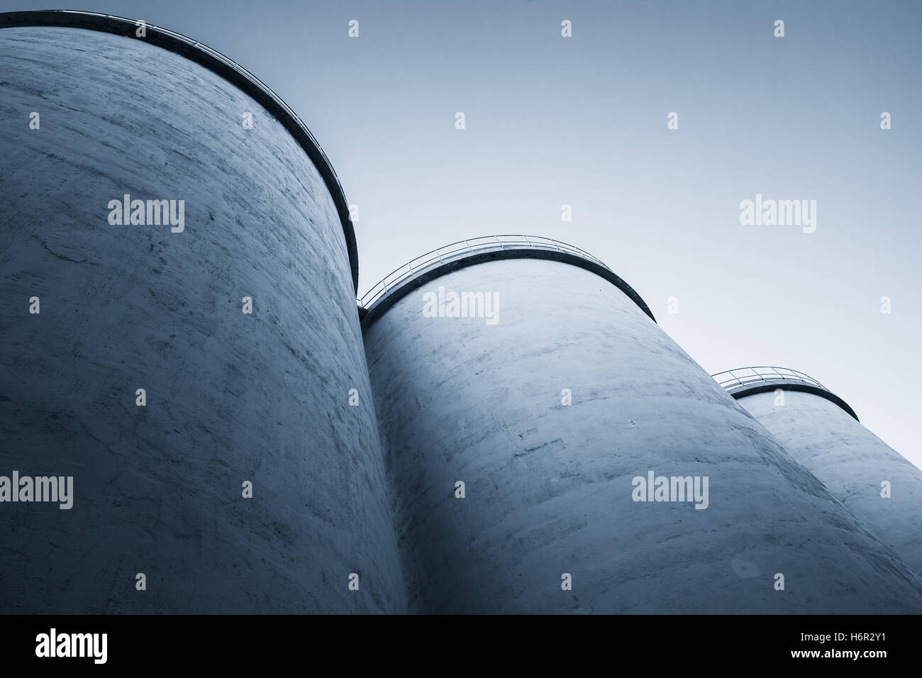 Abstract industrial architecture fragment, large tanks made of concrete ...