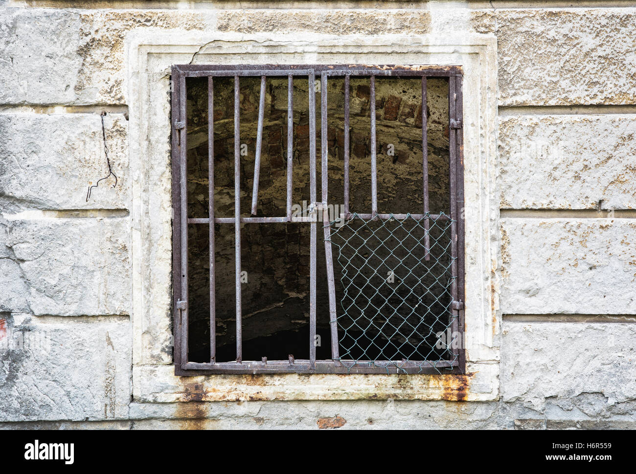 Old wall with barred window. House for demolition. Architectural ...