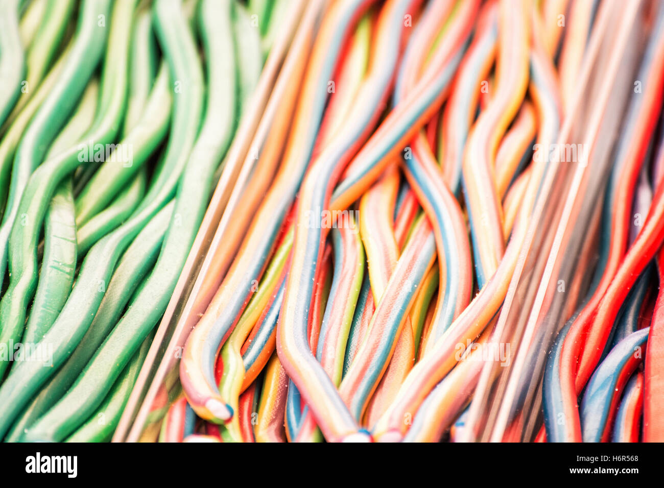 Colorful tasty licorice candies in plastic containers. Sweet delight ...