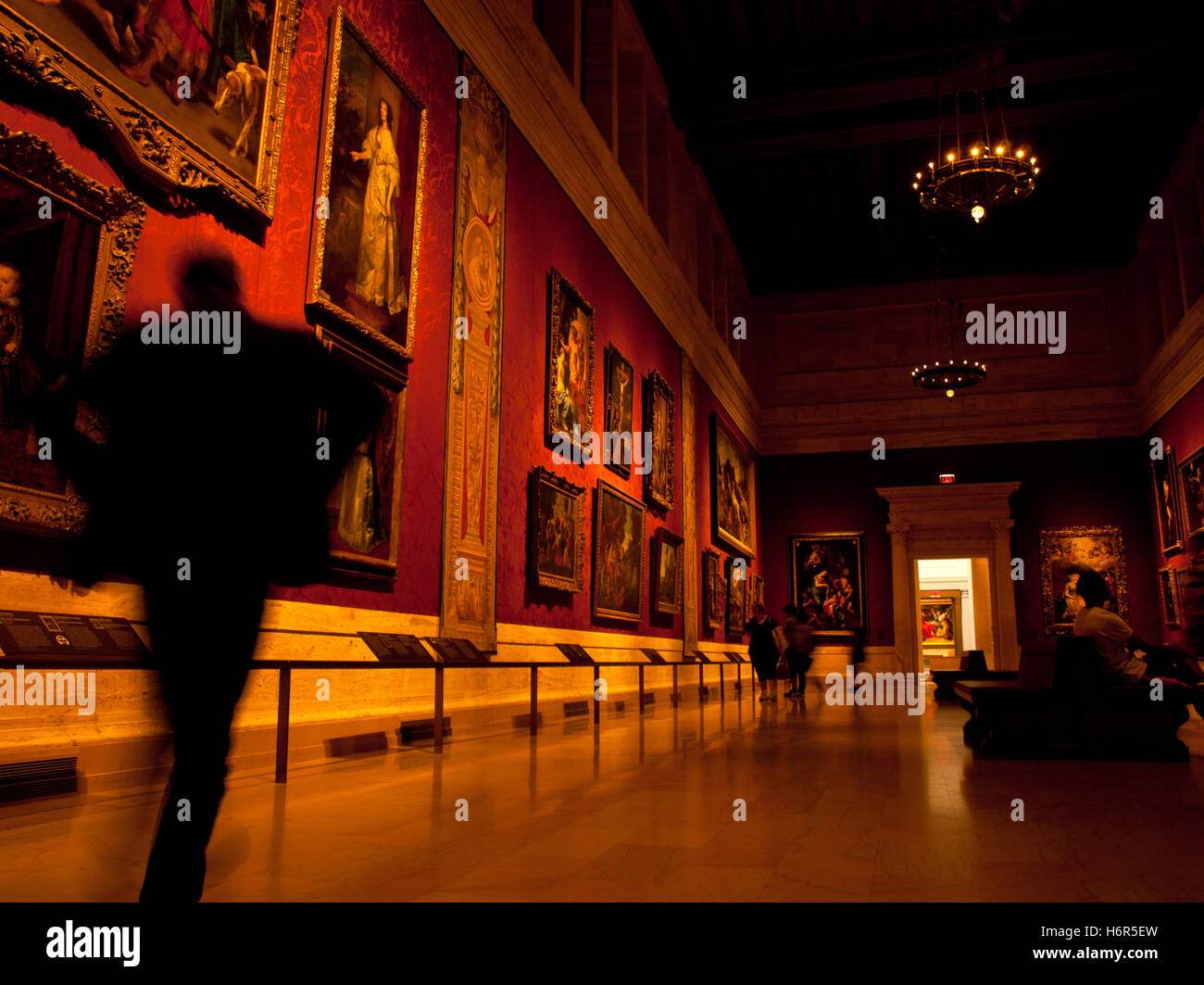 man walking quickly through a museum Stock Photo - Alamy