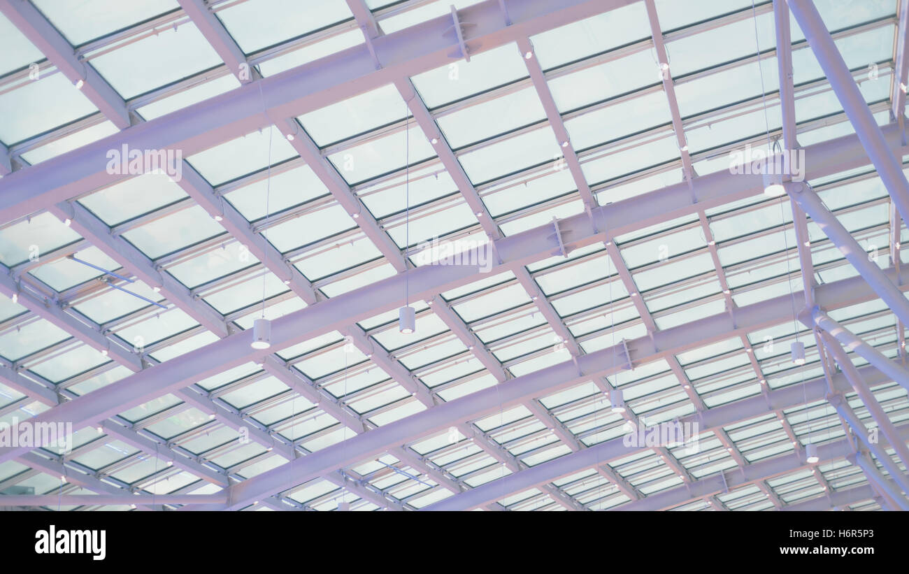 Magenta and blue futuristic abstract glass and steal ceiling receding ...