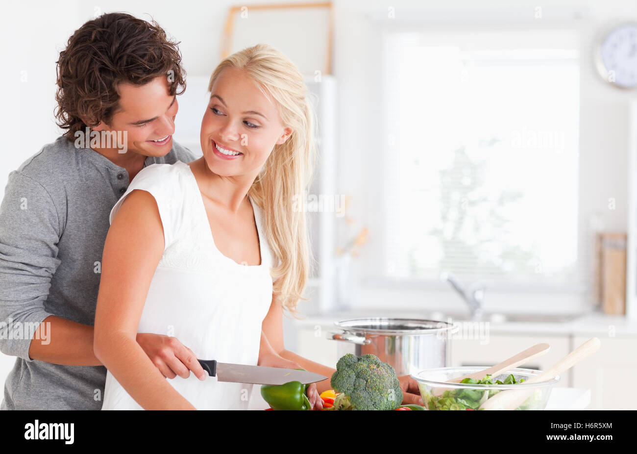 In love couple cooking in their kitchen Stock Photo - Alamy
