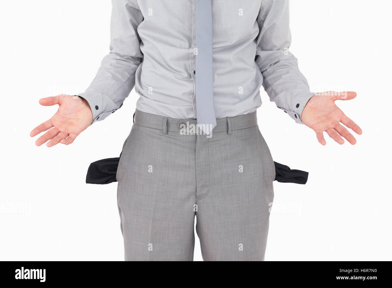 Broke businessman with empty pockets against a white background Stock ...