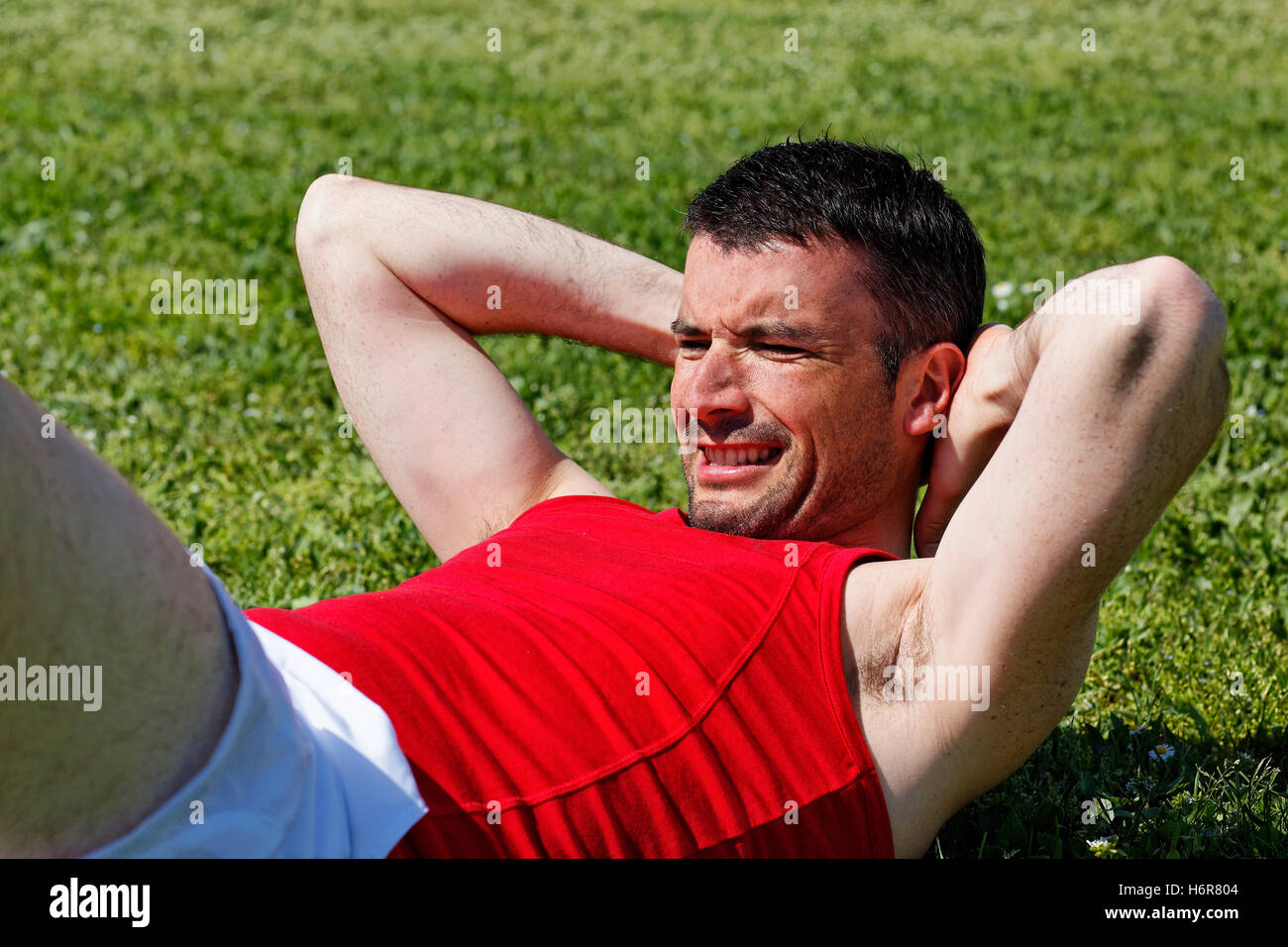 Muscular men sit hi-res stock photography and images - Alamy