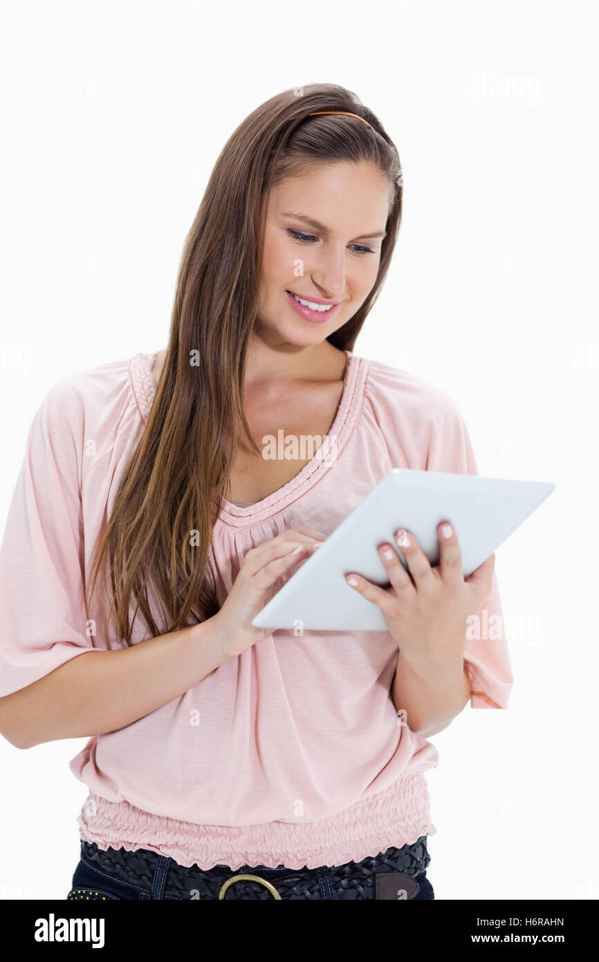 Close-up of a girl using a touchpad against white background Stock ...