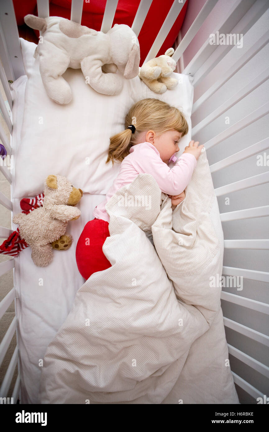 Child tucked bed hi-res stock photography and images - Alamy