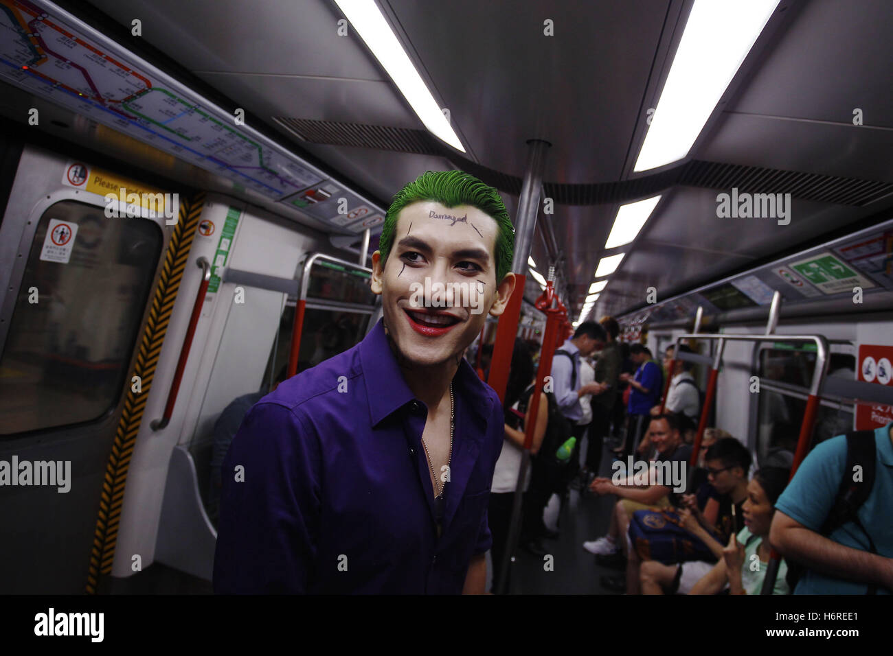 A young man disguised as comic character, JOKER ride a train to Central ...