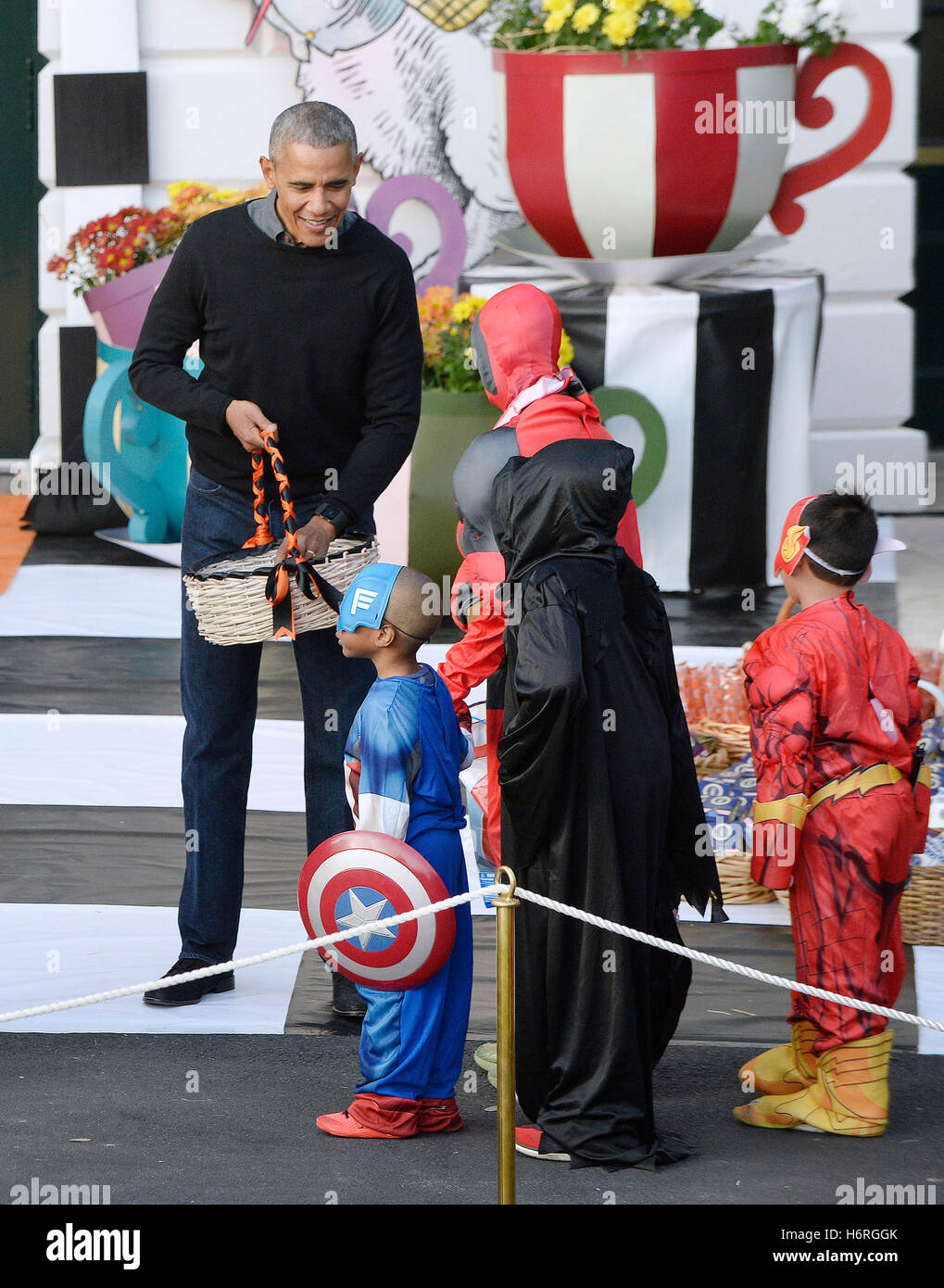 United States President Barack Obama hands out treats during a ...