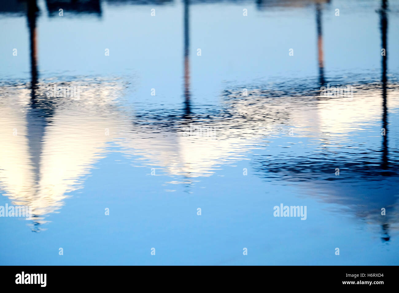 the reflection of sun umbrellas in swimming pool water Stock Photo - Alamy