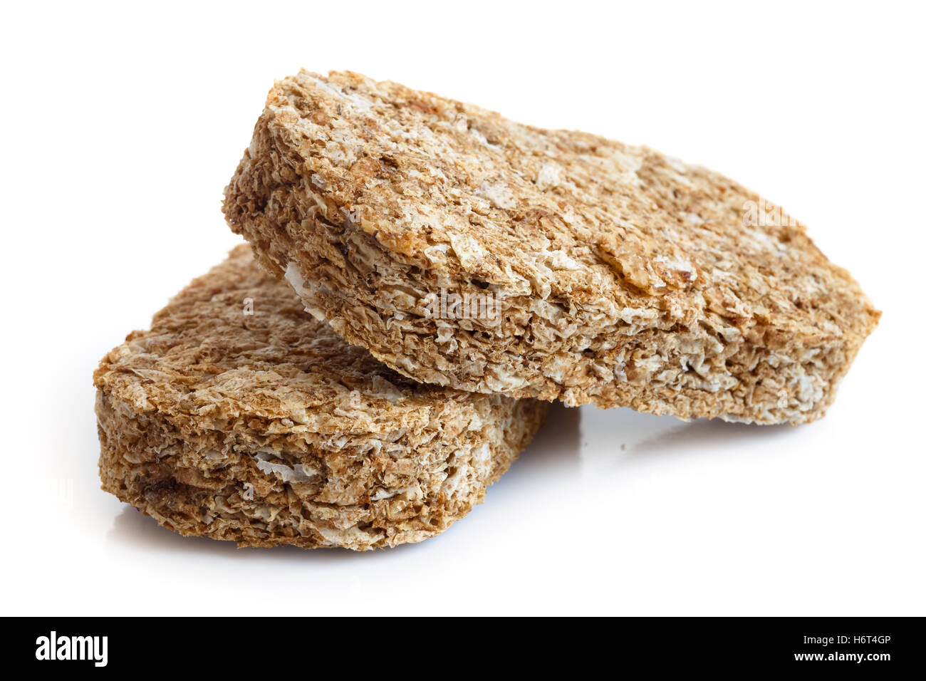 Two whole wheat breakfast biscuits isolated on white in perspective ...