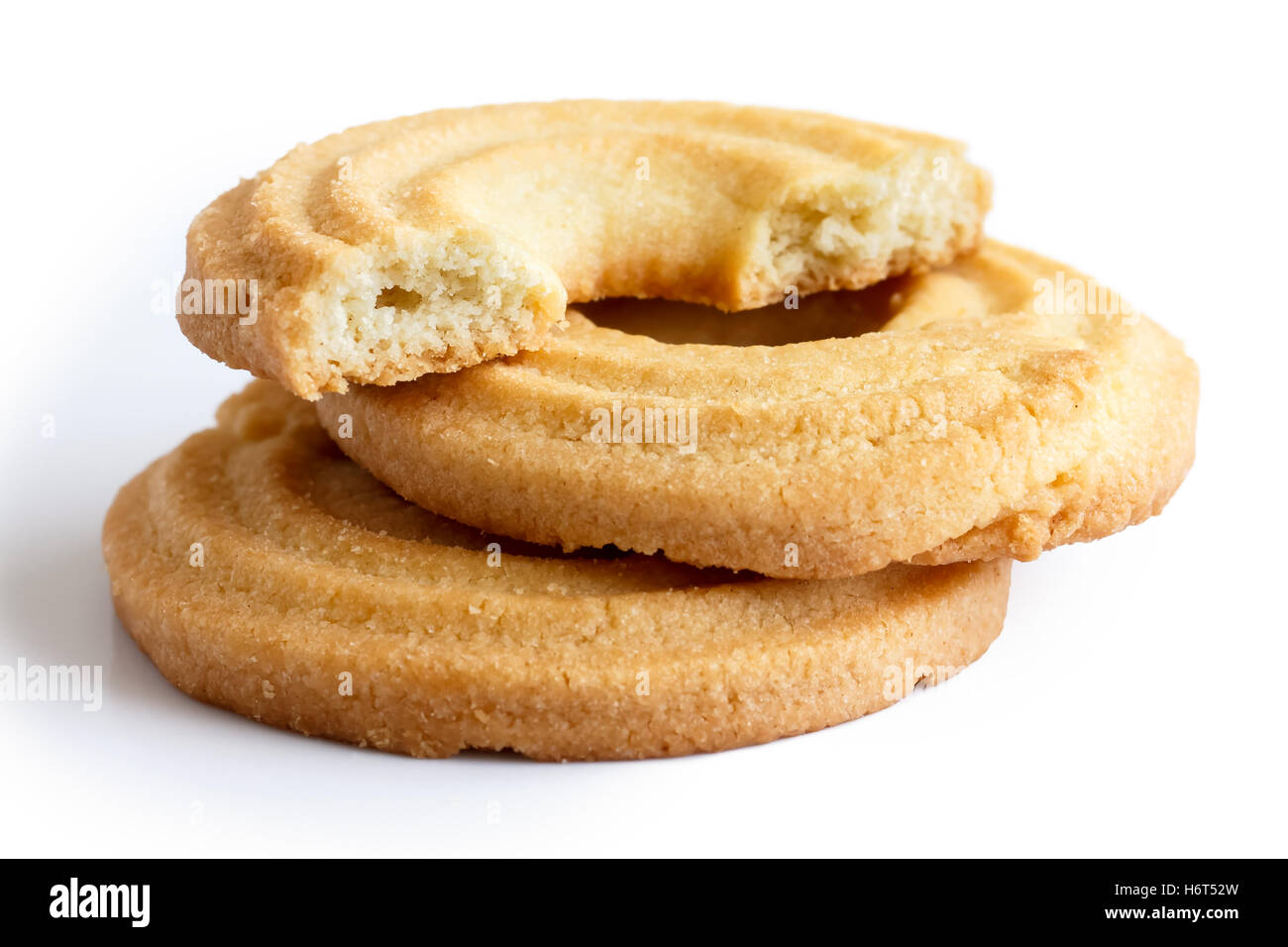 Three butter ring biscuits isolated on white in perspective. One broken ...