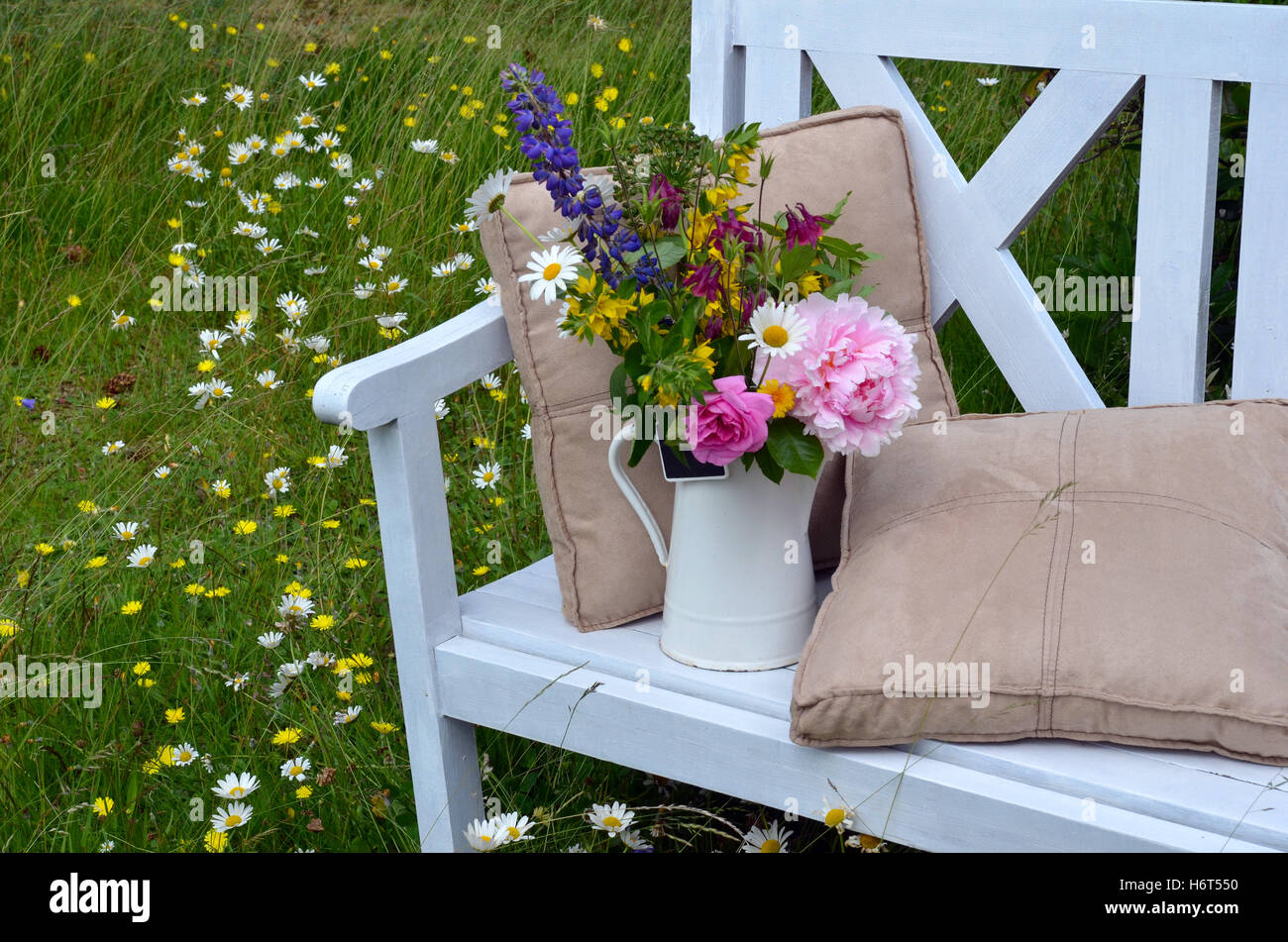 garden bench flower meadow Stock Photo - Alamy