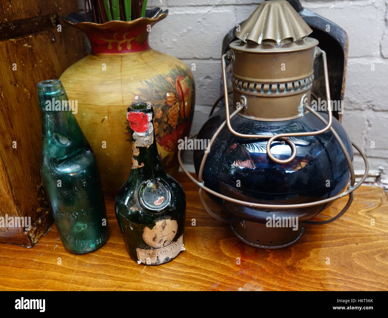 A collection of antique and rustic items on an old table Stock Photo ...