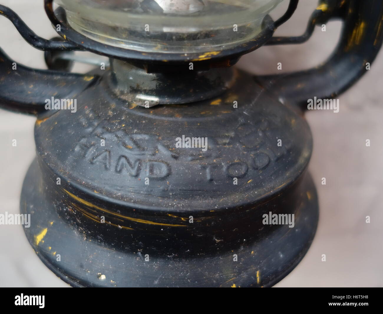 The bottom of an old lamp labeled 'hand tool' Stock Photo - Alamy