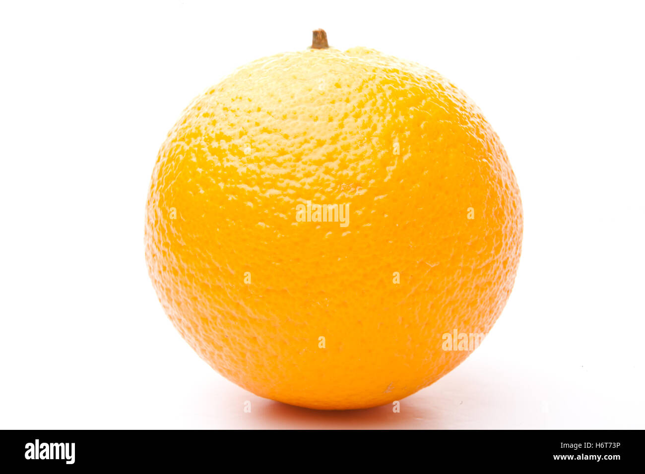 One orange against white background Stock Photo - Alamy