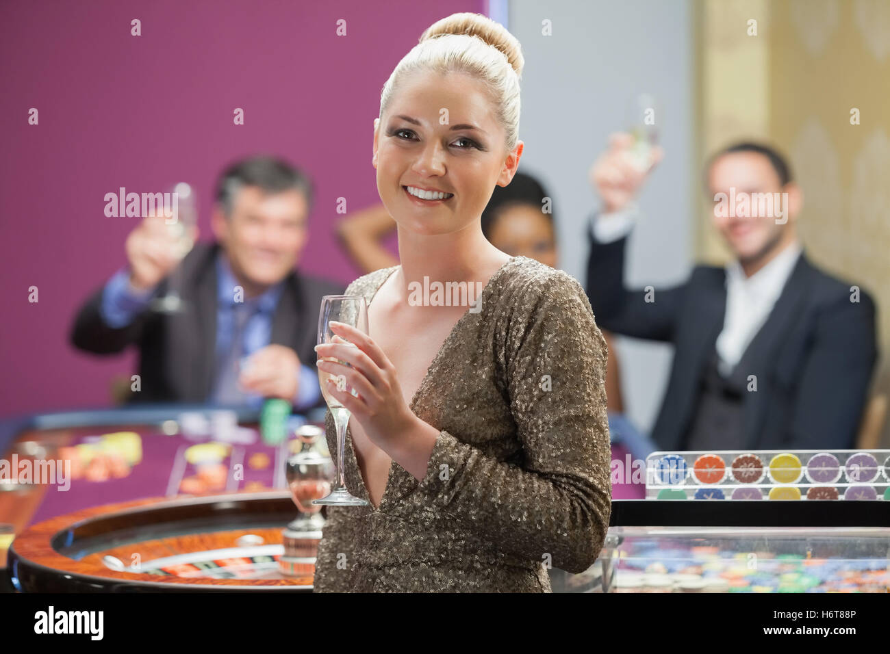 Woman champagne roulette table hi-res stock photography and images - Alamy