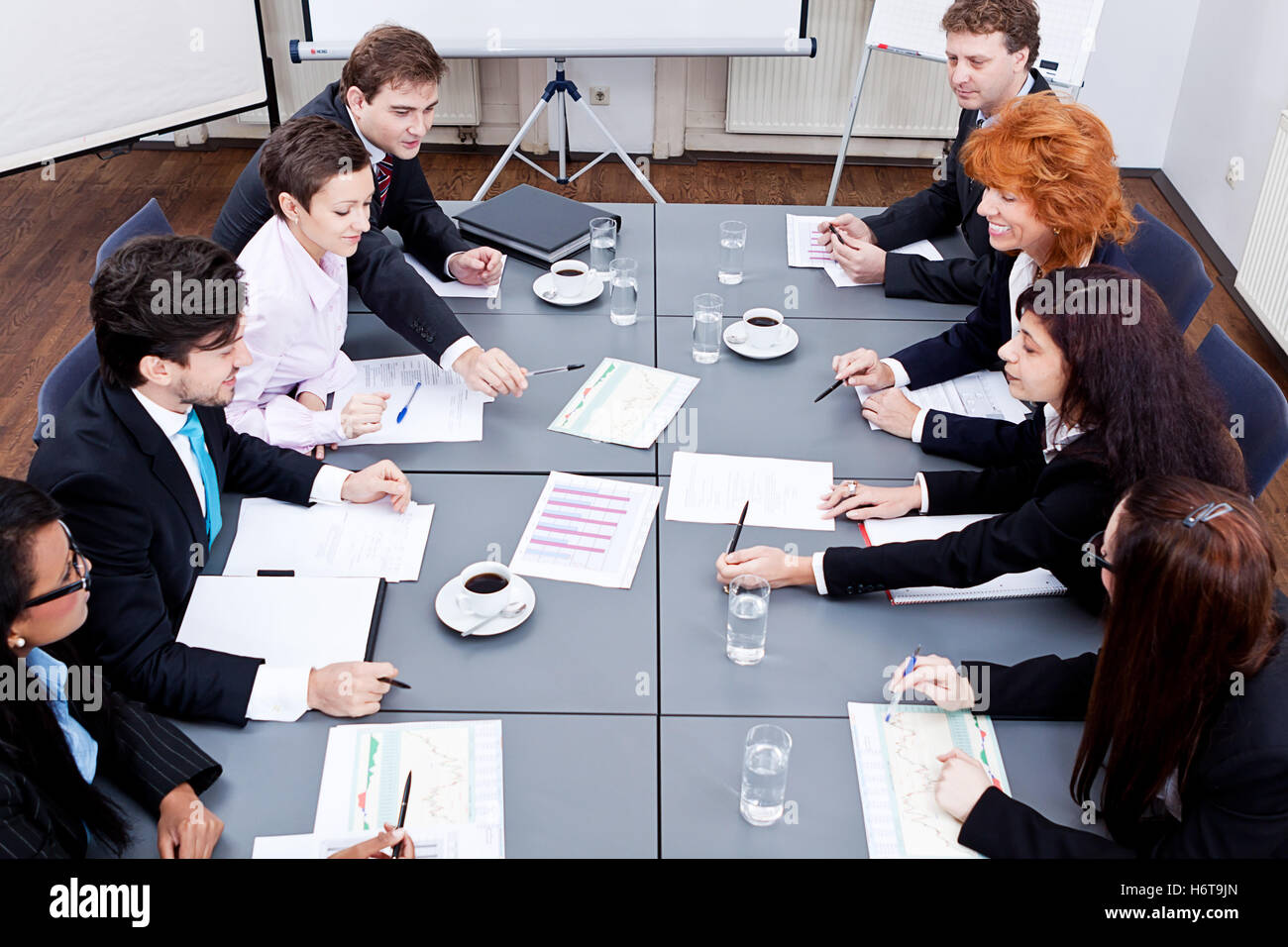 business people at a table in a conference Stock Photo - Alamy