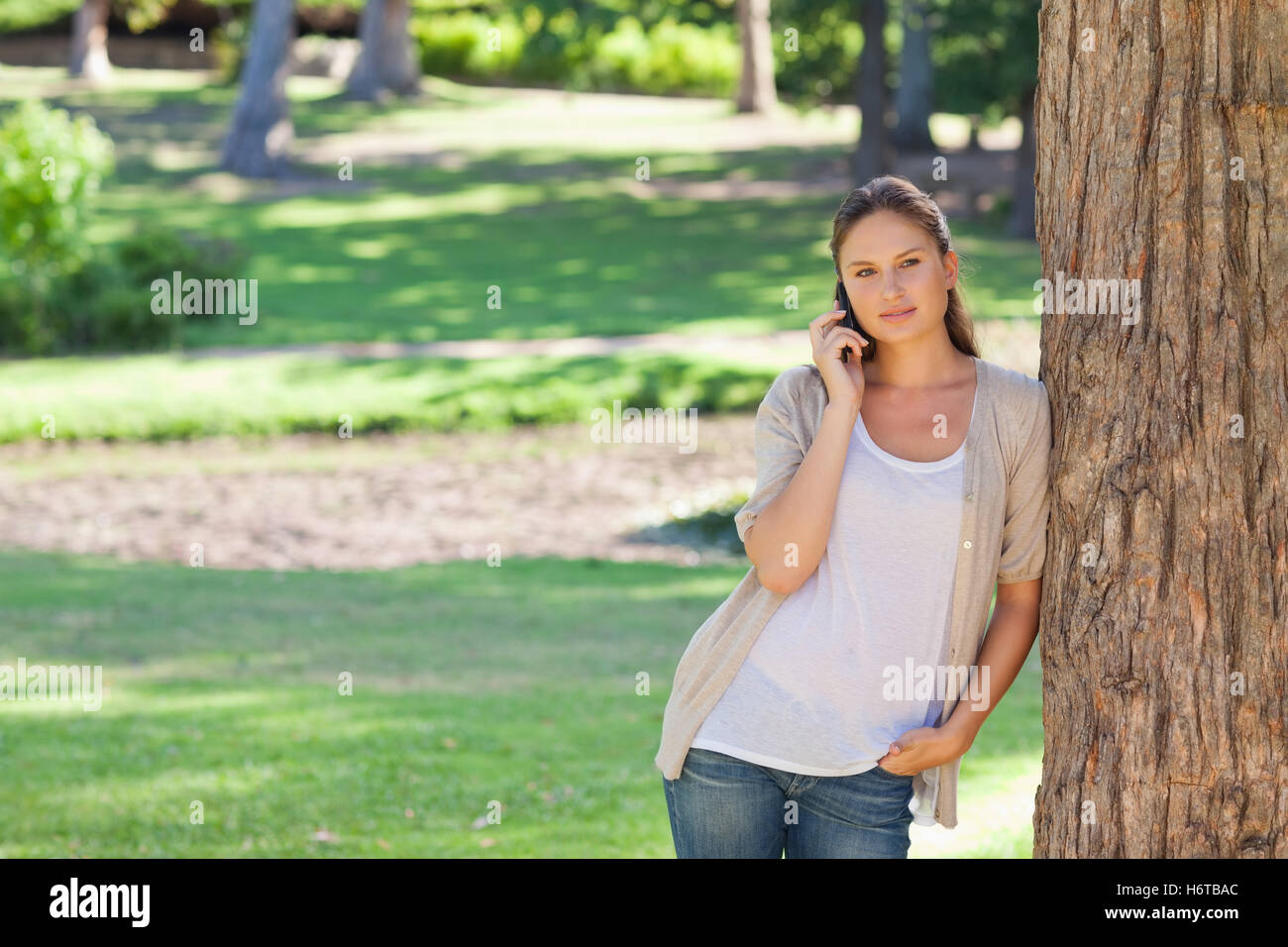 Lean against tree standing hi-res stock photography and images - Alamy