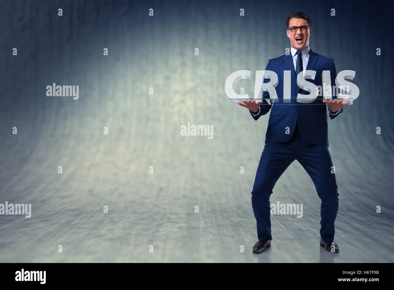 Man struggling with crisis in business concept Stock Photo - Alamy