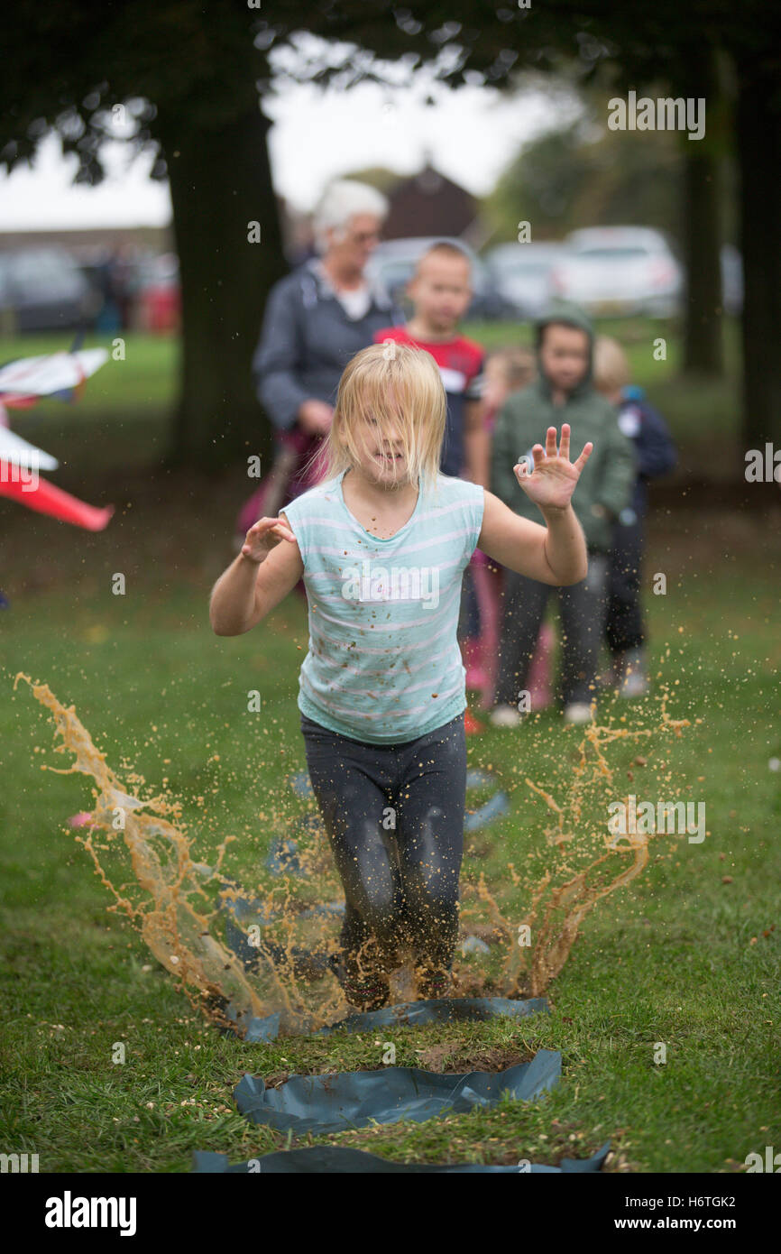 Youngsters taking part in the World Puddle Jumping Contest held at ...