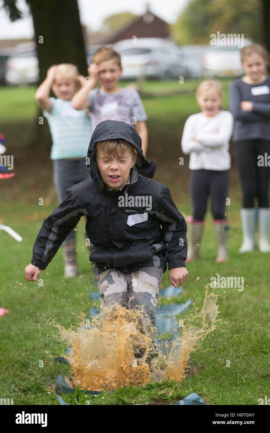 Youngsters taking part in the World Puddle Jumping Contest held at ...