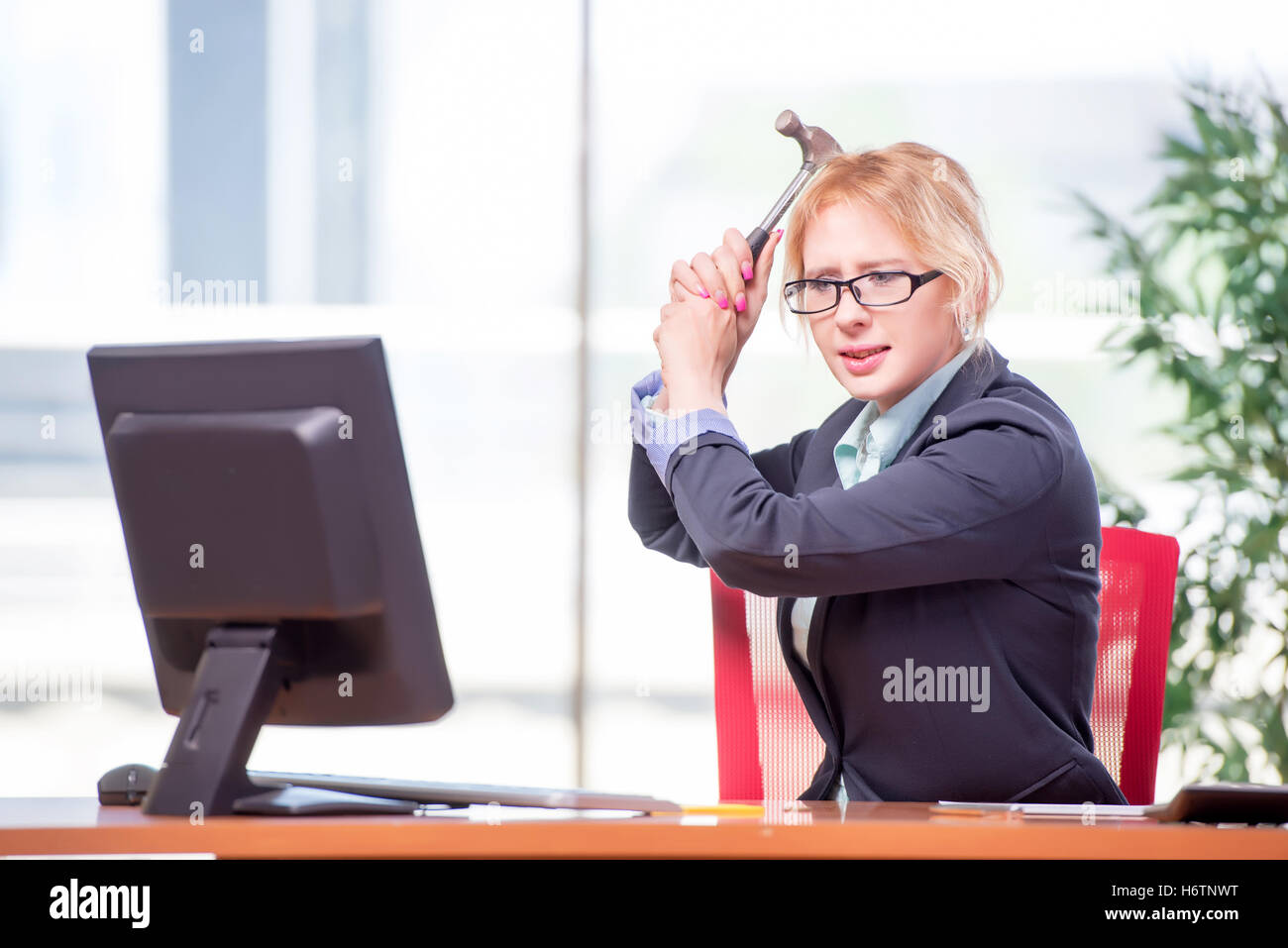 Businesswoman working in the office Stock Photo - Alamy