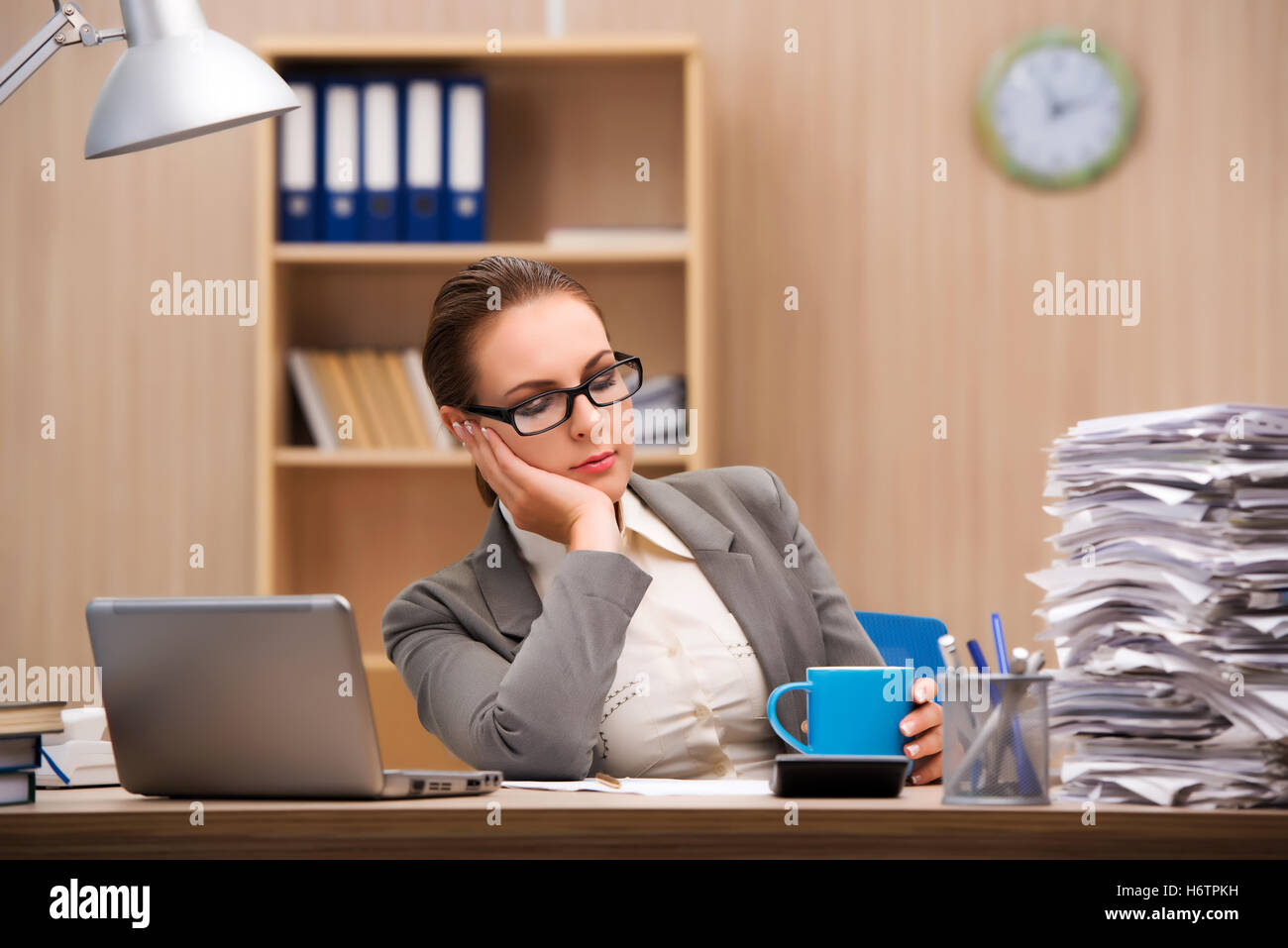 Businesswoman under stress from too much work in the office Stock Photo ...