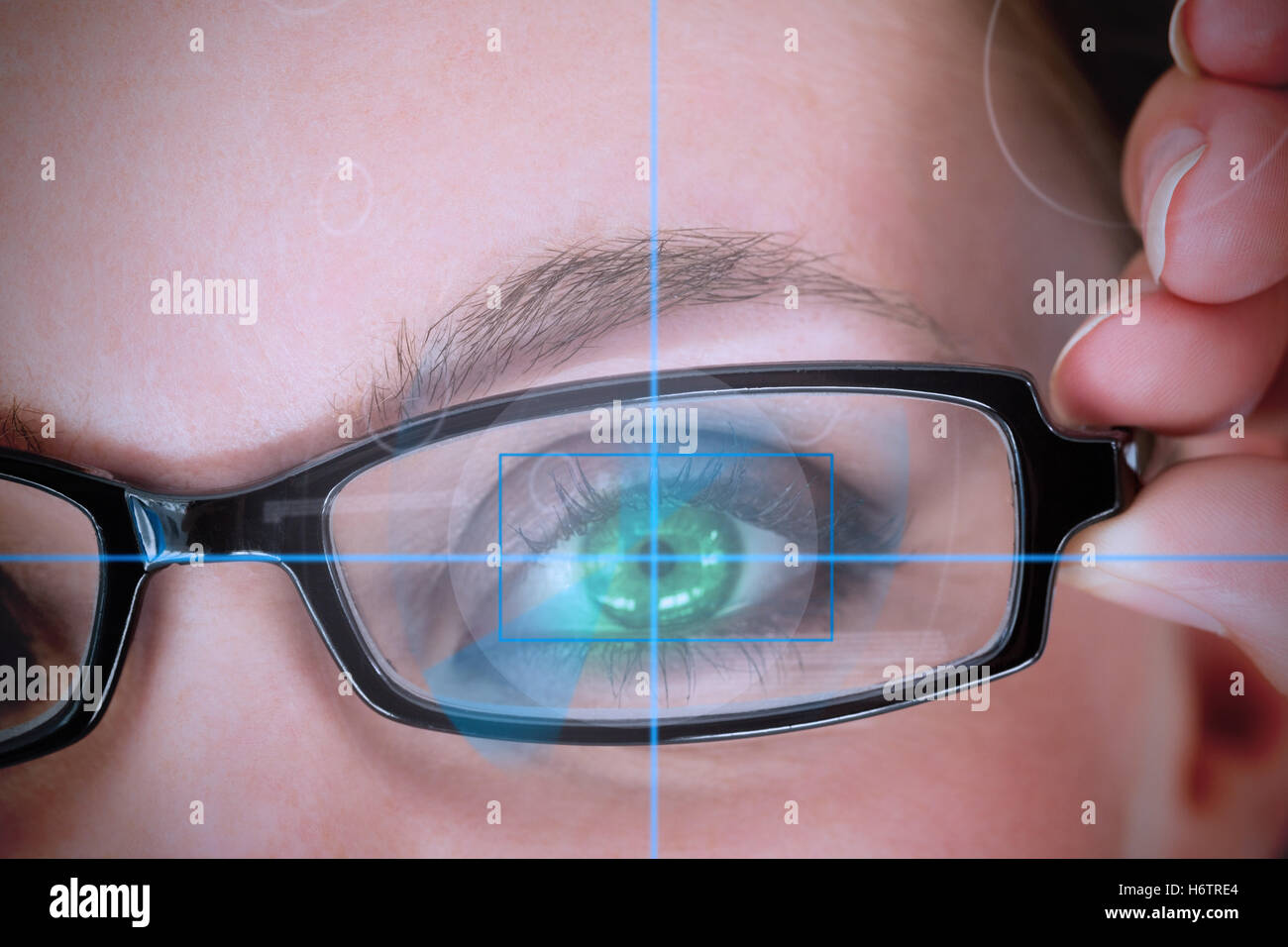 Woman with green eyes analyzing something with a target line Stock ...