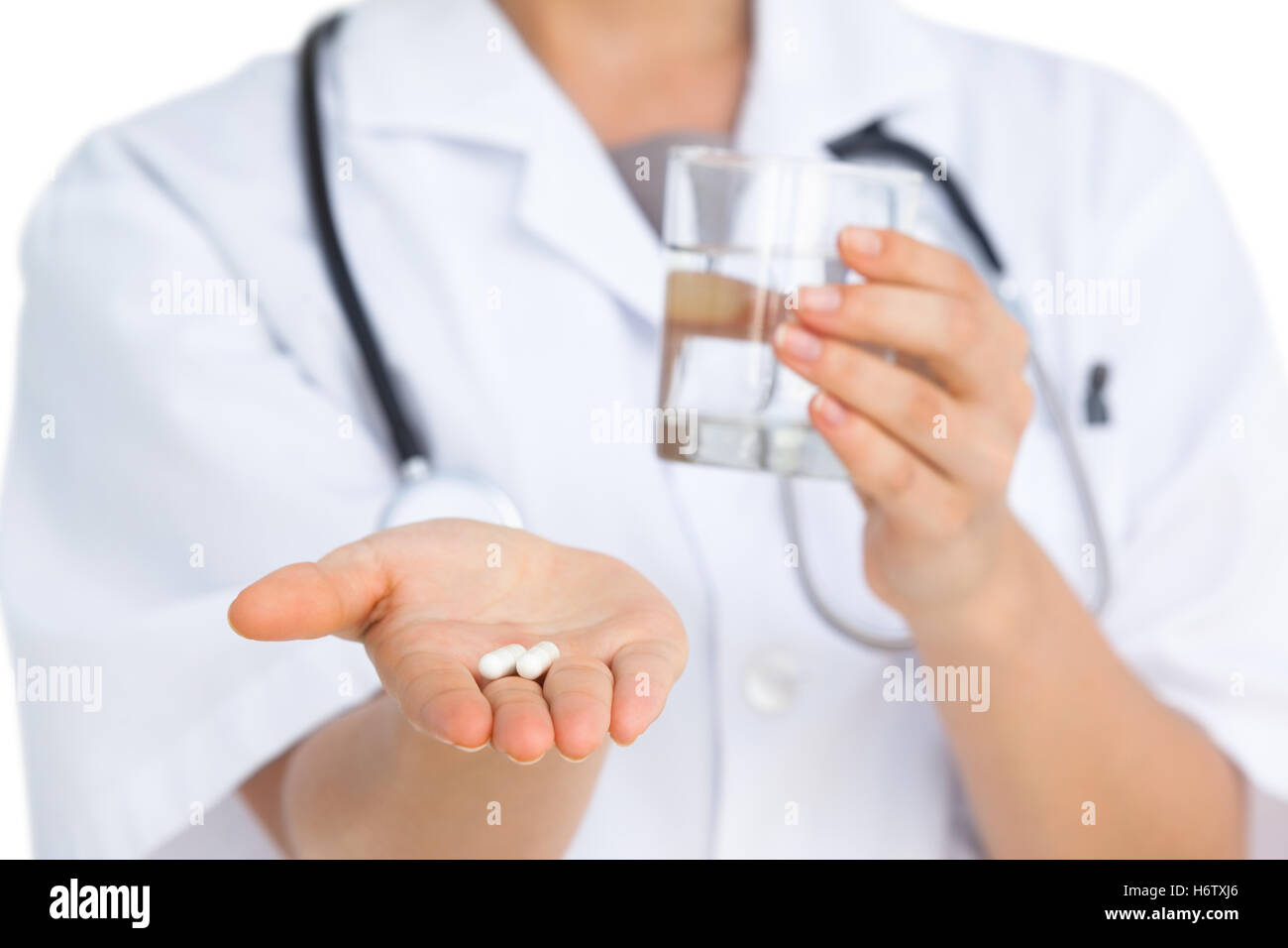 Drugs held by nurse wearing uniform on white background Stock Photo - Alamy
