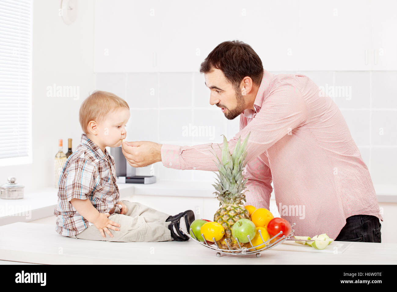 health son fruit kitchen cuisine cut feed child eating eat eats apple ...