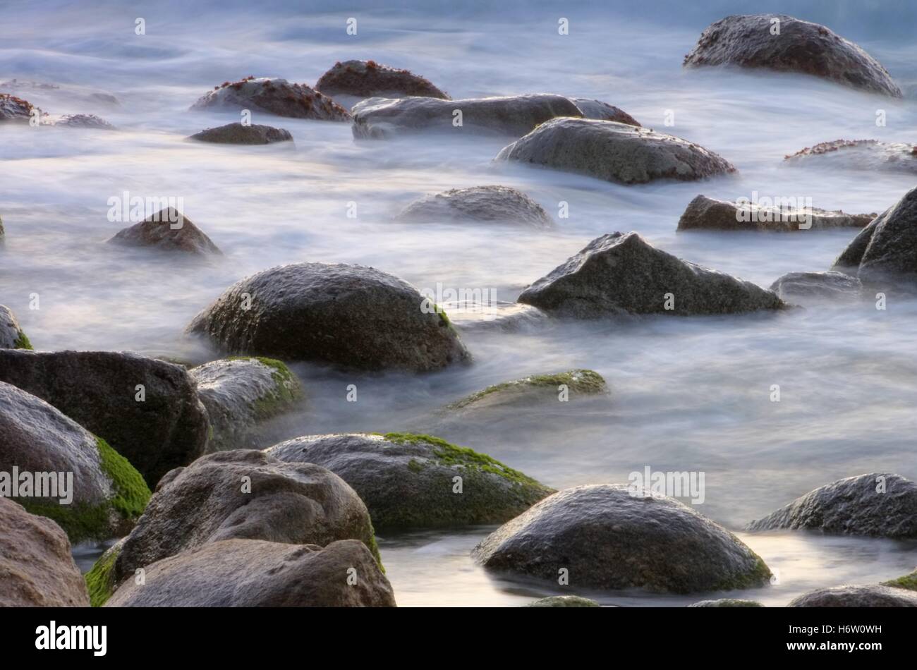 rocks in the surf - rocks in surf 02 Stock Photo - Alamy