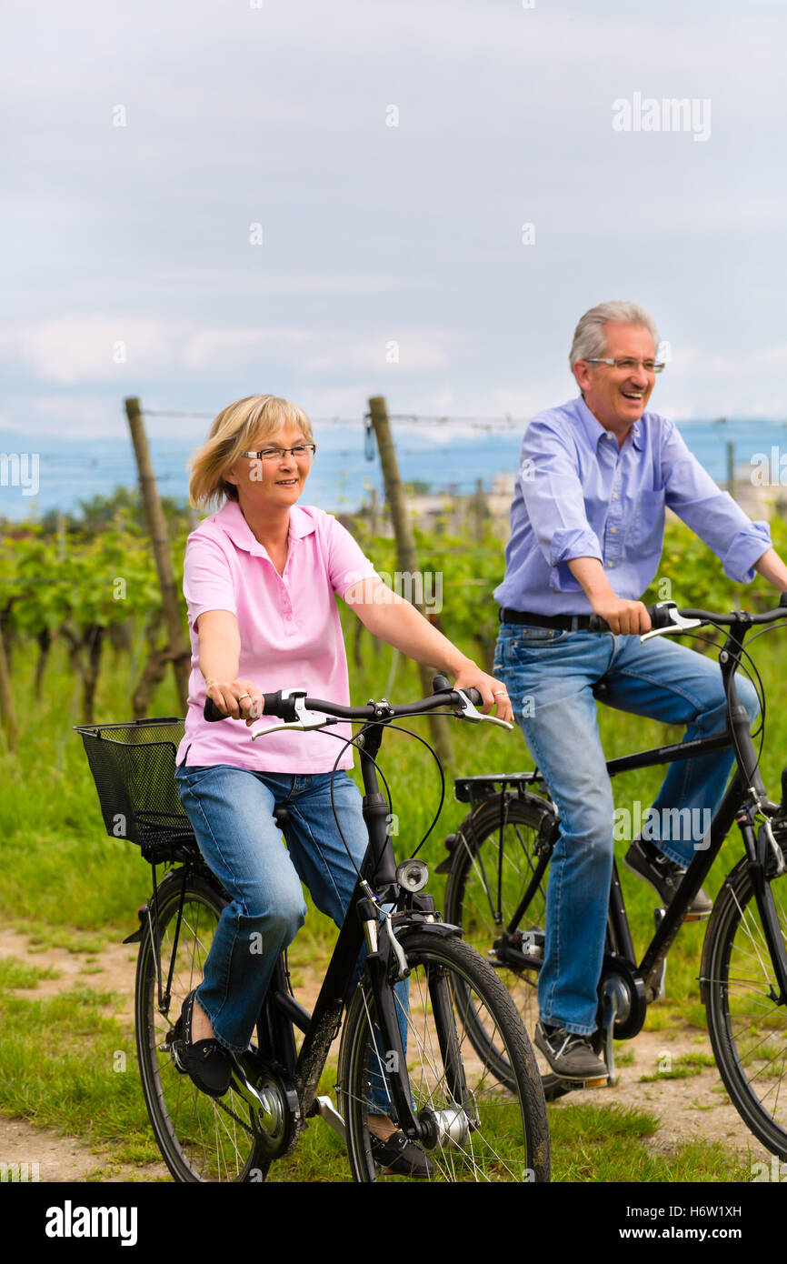 sport sports retirement outing bike bicycle cycle couple pair cycling ...