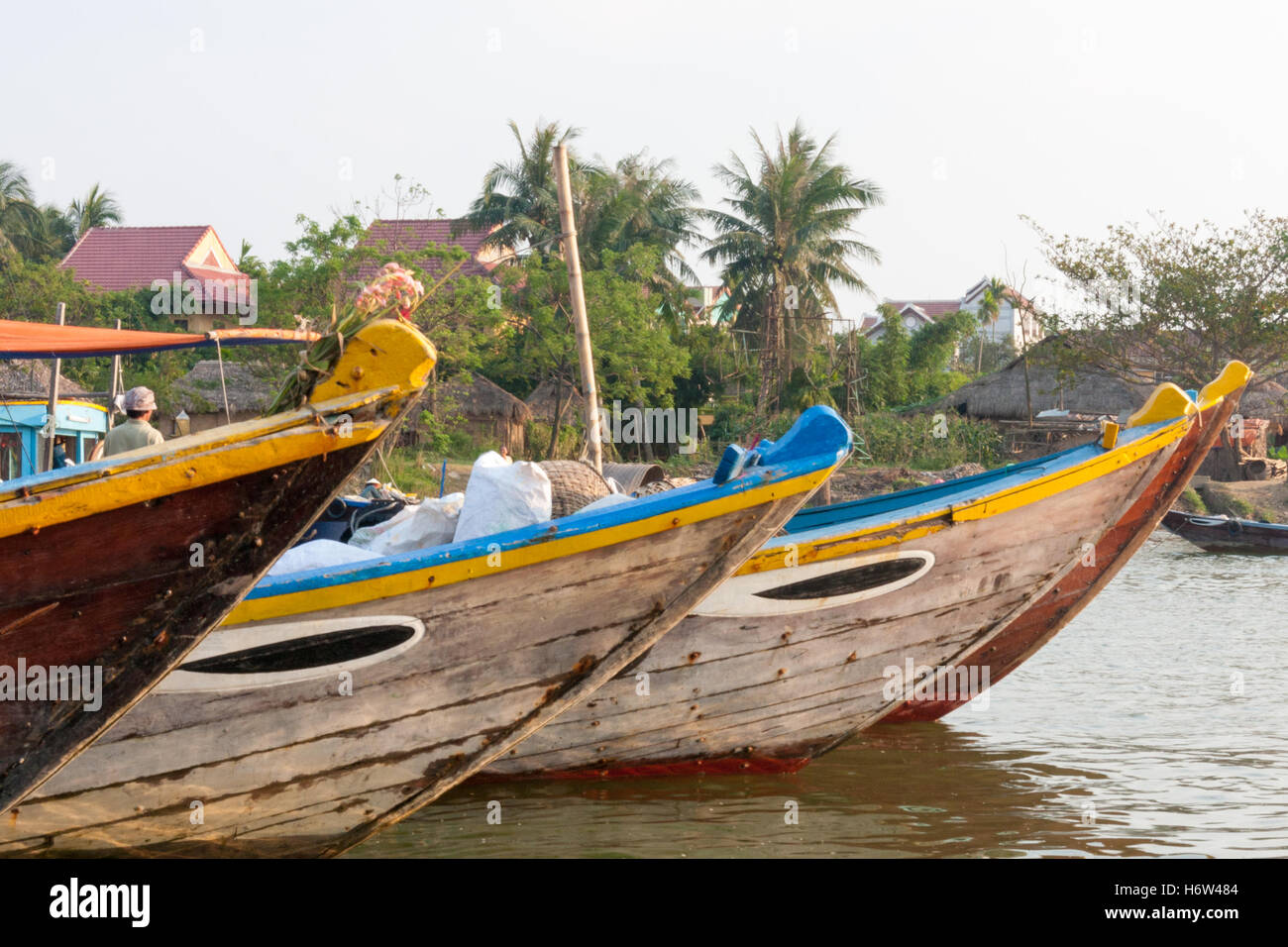Prows of fishing boats moored on the river in Hoi An Stock Photo - Alamy