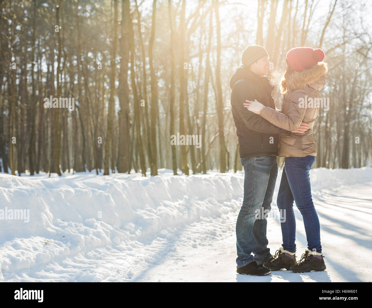 Happy Young Couple in Winter Park having fun. Family Outdoors. love Stock Photo - Alamy