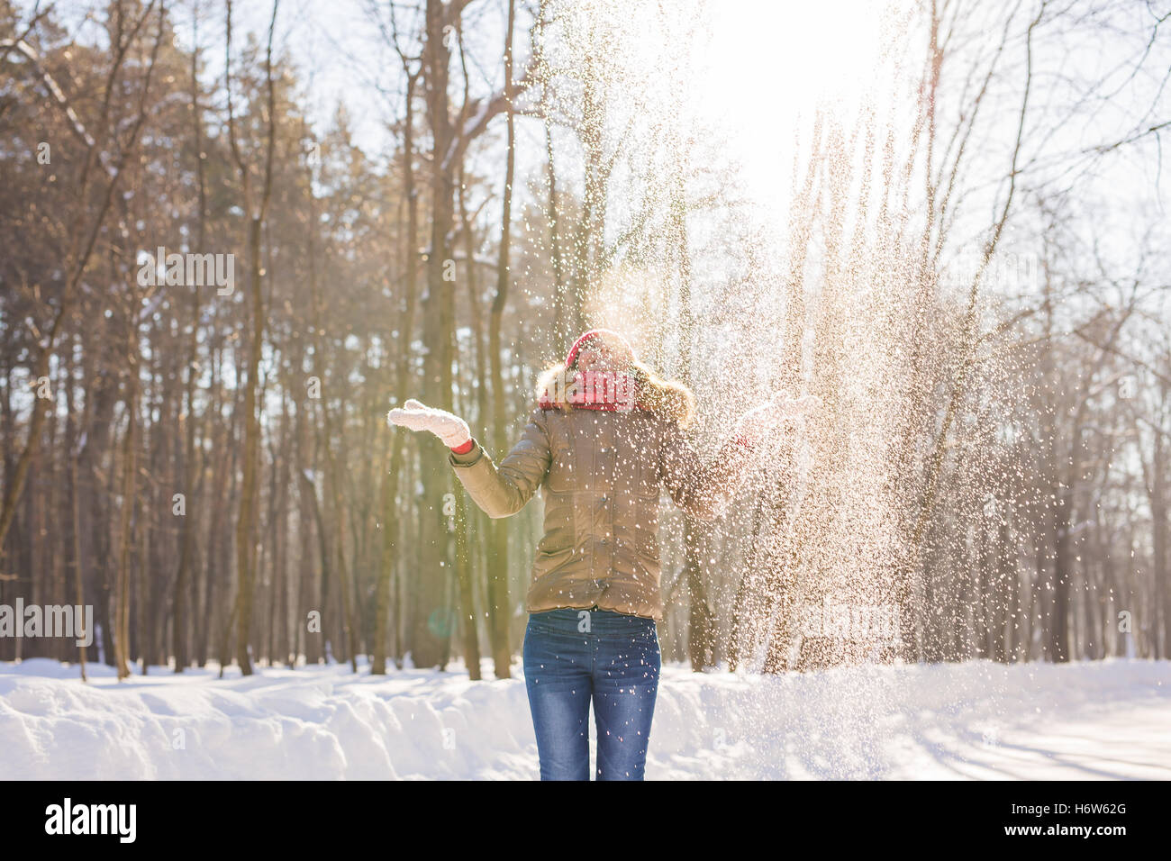 Beauty Girl Blowing Snow in frosty winter Park. Outdoors. Flying ...