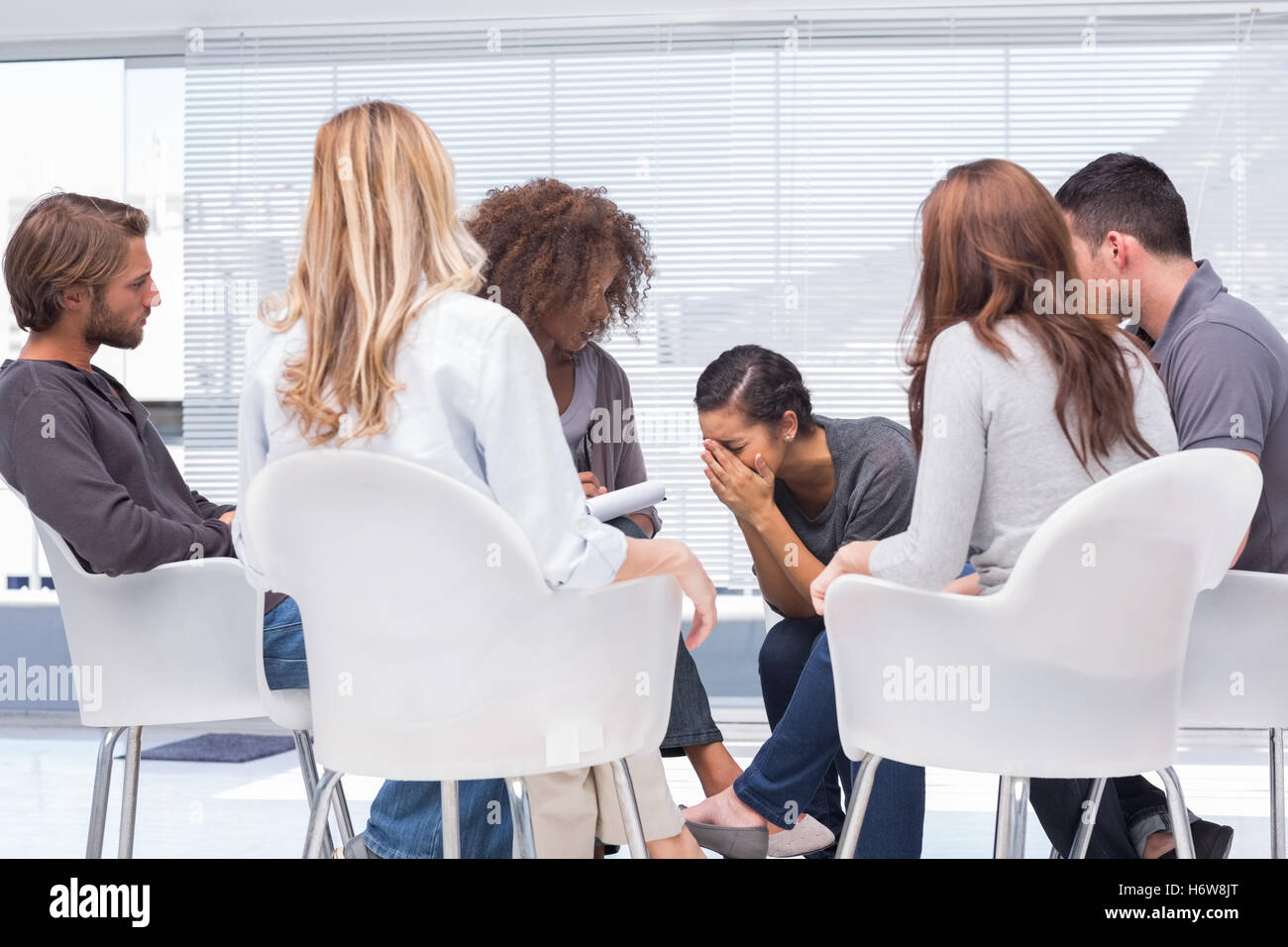 Woman crying during group therapy hi-res stock photography and images ...