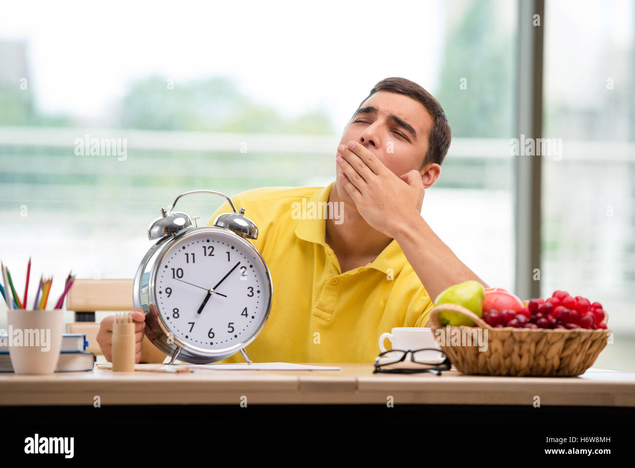 Student missing deadlines for exam preparation Stock Photo - Alamy