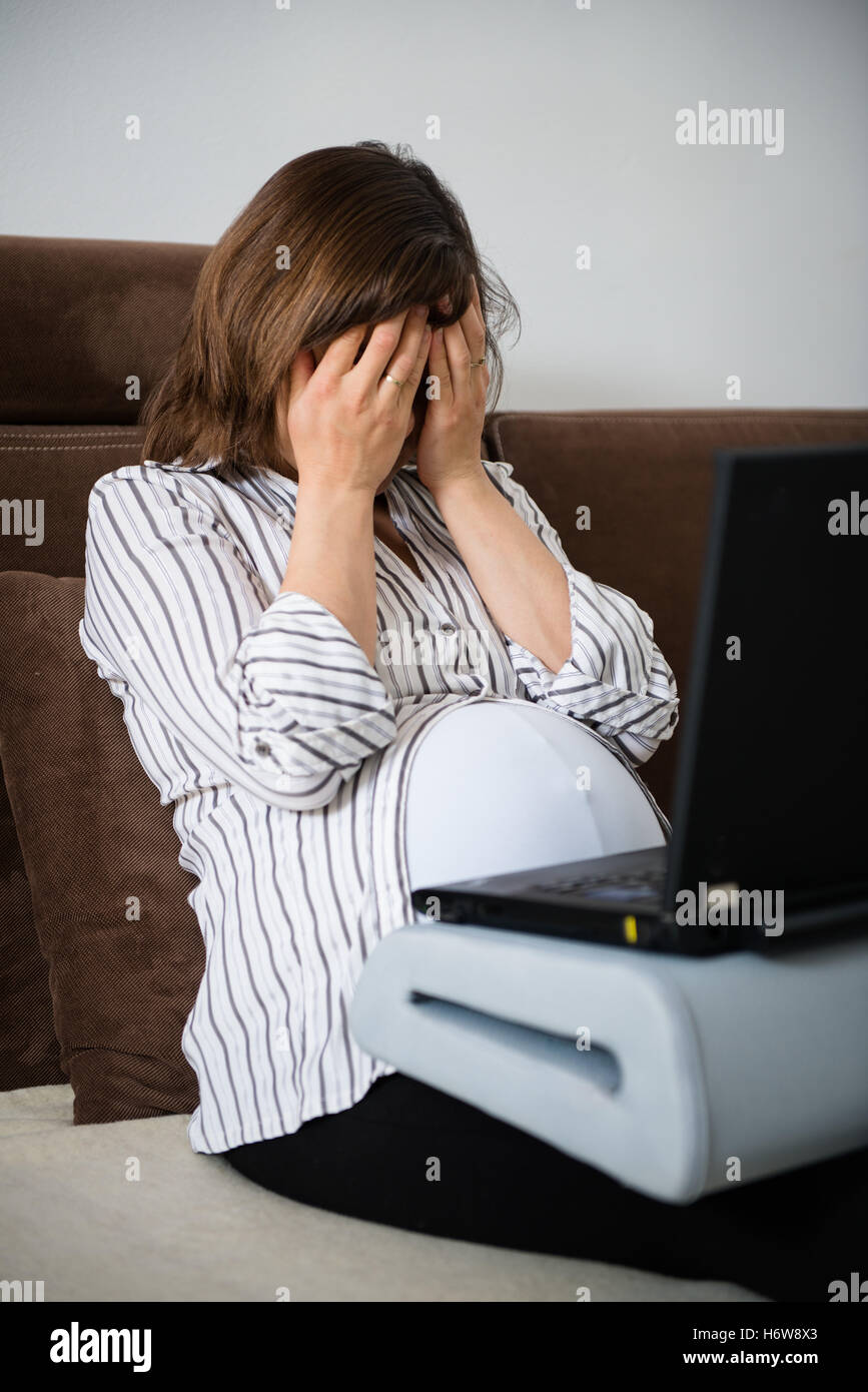 woman laptop notebook computers computer headache concern worried worry ...