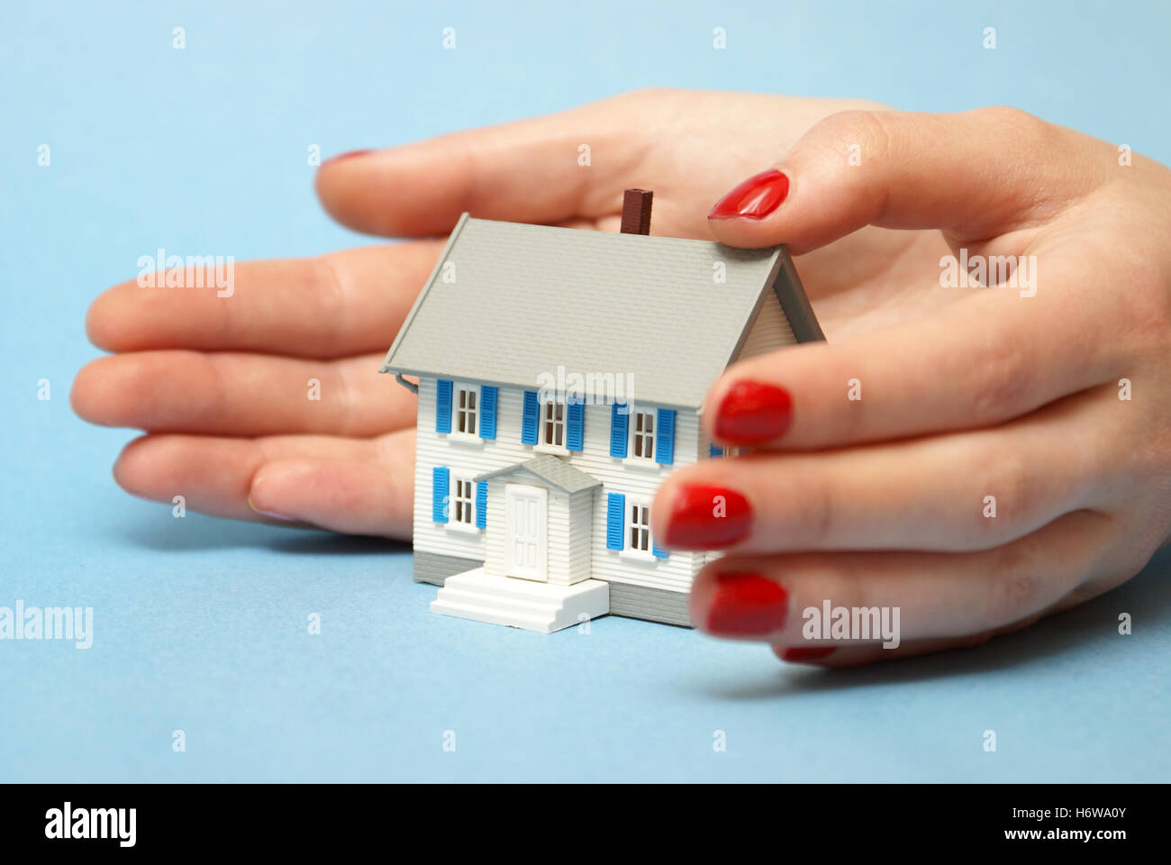 woman blue house building hand hands sell model design project concept ...