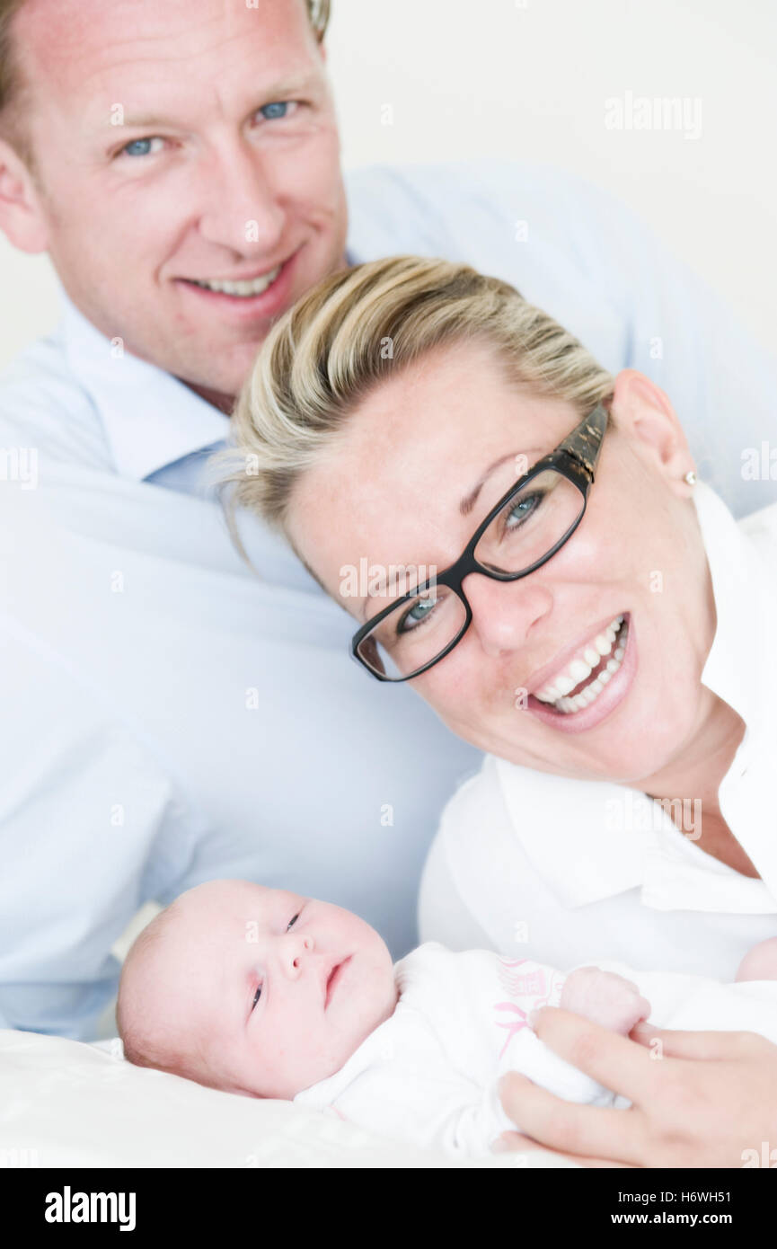 Happy parents with baby Stock Photo - Alamy
