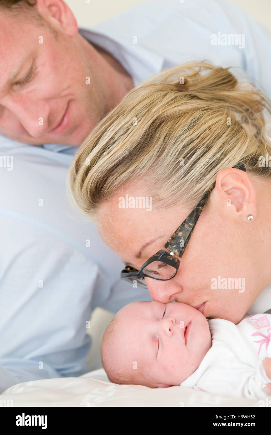 Happy parents with baby Stock Photo - Alamy
