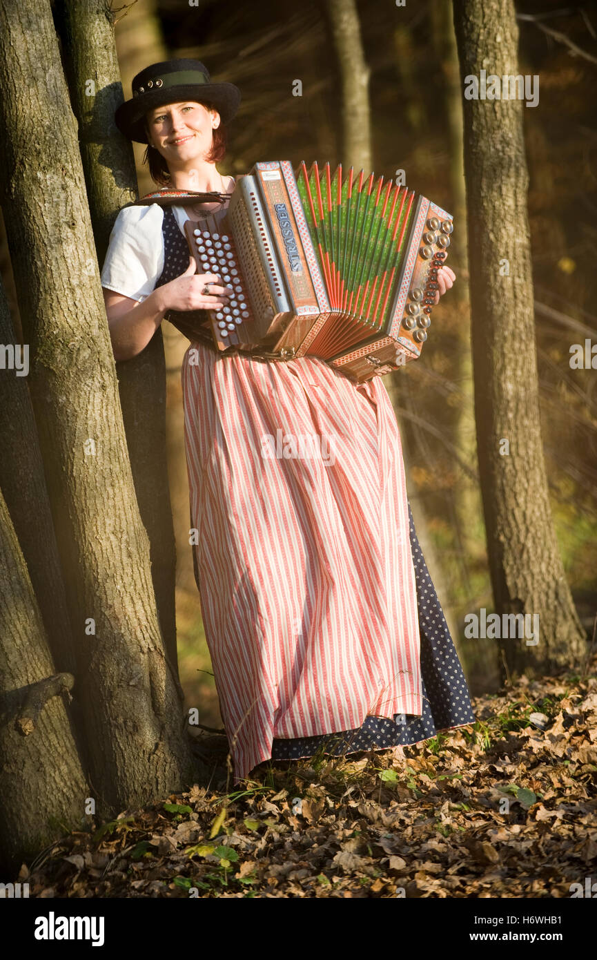 Woman in traditional attire plays hi-res stock photography and images ...