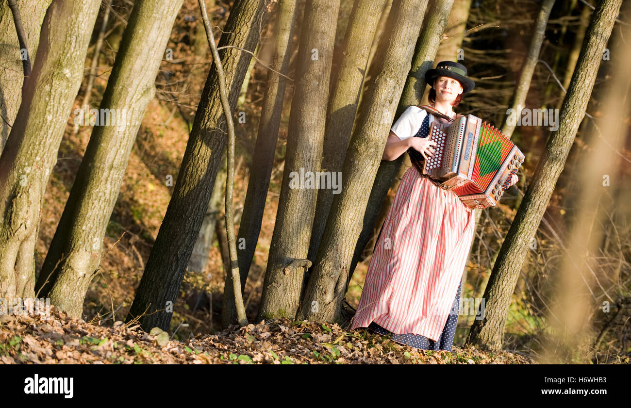 Woman in traditional costume with Styrian harmonica Stock Photo - Alamy