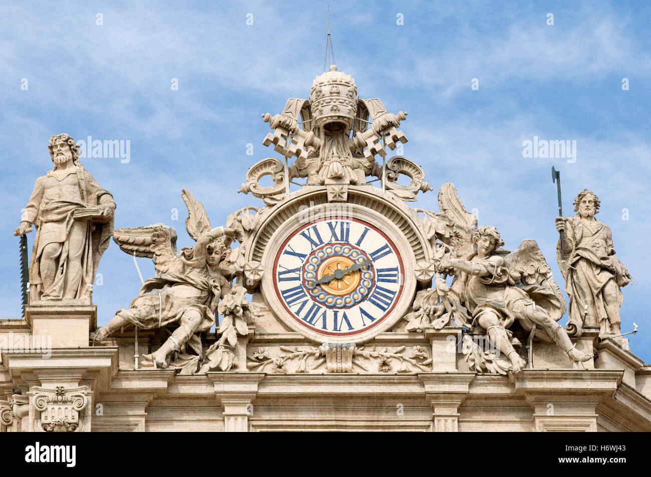 Clock and statues on St. Peter's Basilica on St. Peter's Square ...