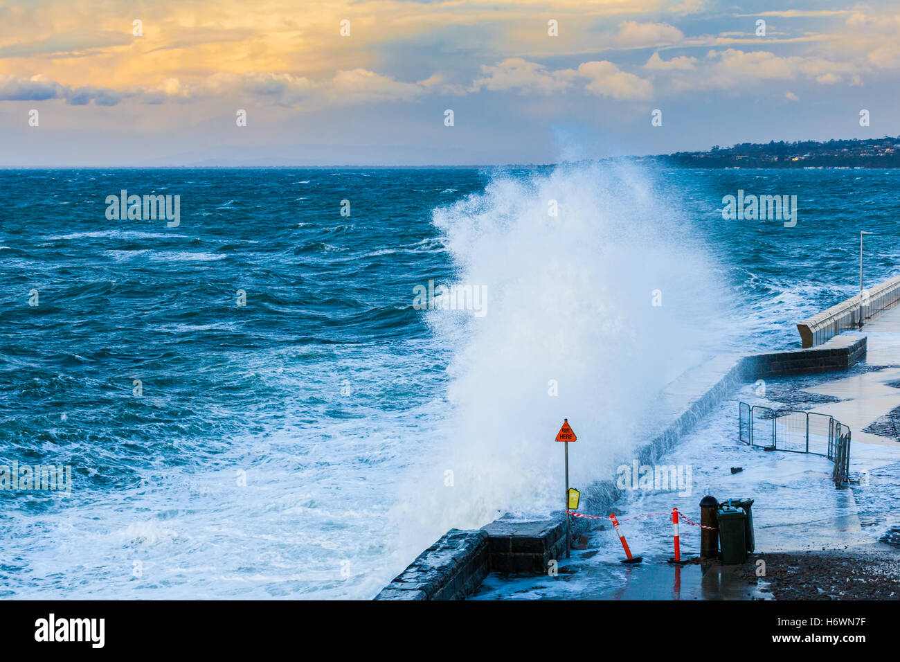 Big wave crushing on Mornington Pier in high wind. Melbourne, Victoria ...